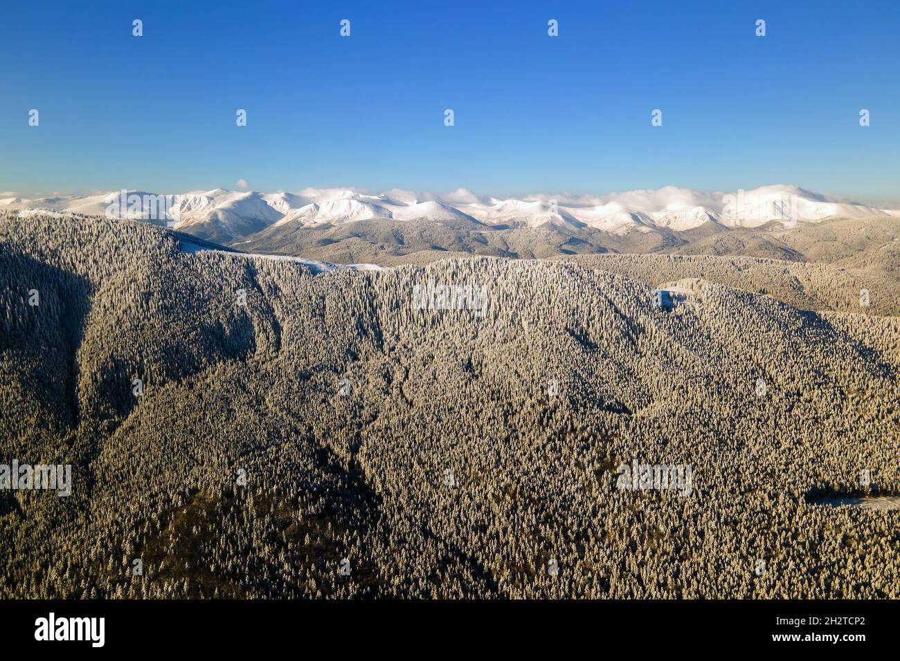 Aerial view of winter landscape with mountain hills covered with ...