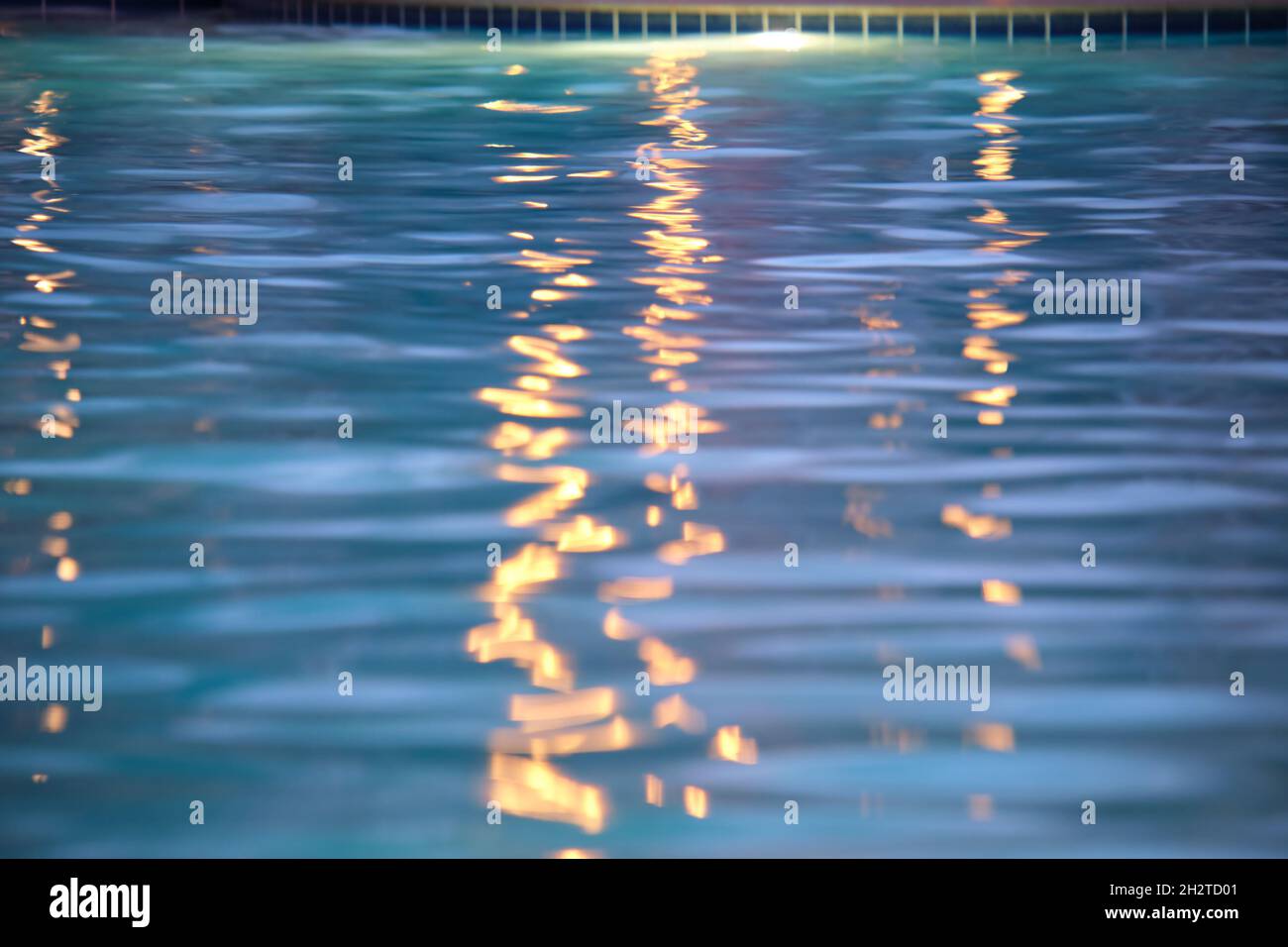 Closeup surface of blue clear water with small ripple waves in swimming ...