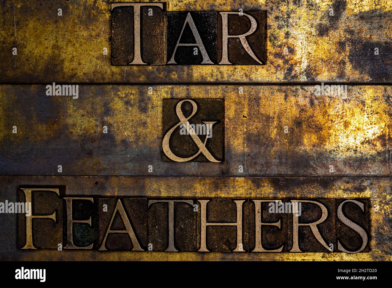 Tar and Feathers text on textured grunge copper and vintage gold ...