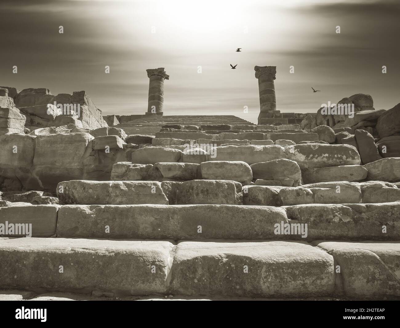 Old steps made from big rocks guarded by two roman architectural ...