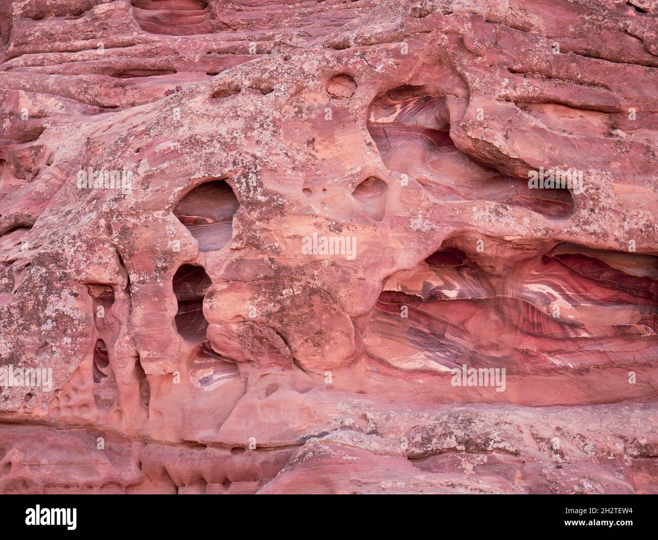 Red rock stone sand texture background. Red Stone wall in Petra, Jordan ...
