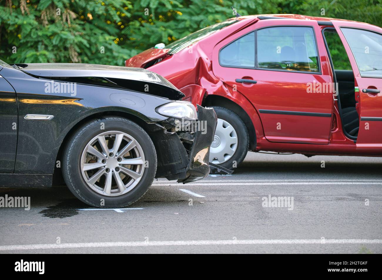 Damaged in heavy car accident vehicles after collision on city street ...