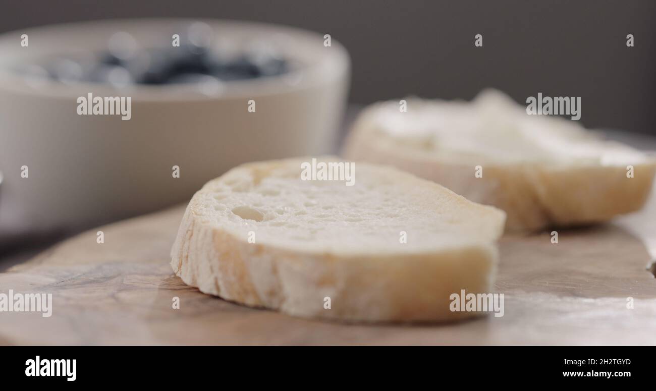 ciabatta bread slice on olive board, wide photo Stock Photo - Alamy