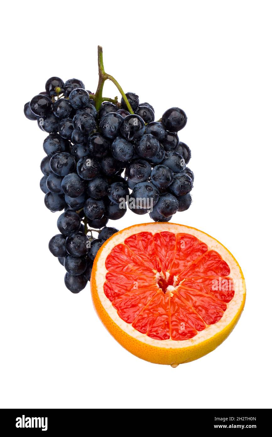Dark blue grape with red grapefruit isolated on white background Stock ...