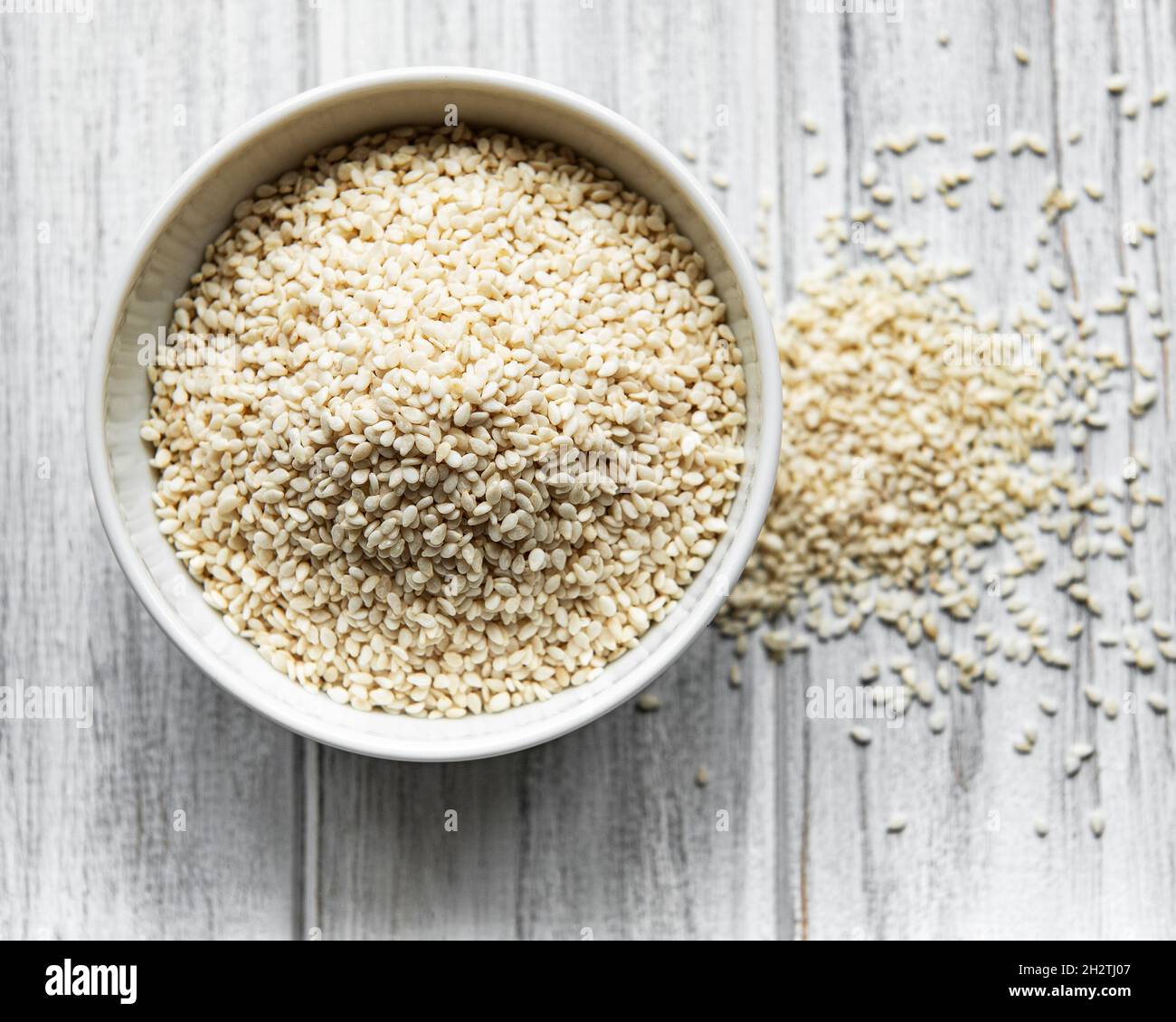 Healthy food and drink concept. Sesame seeds in a bowl on a rustic ...