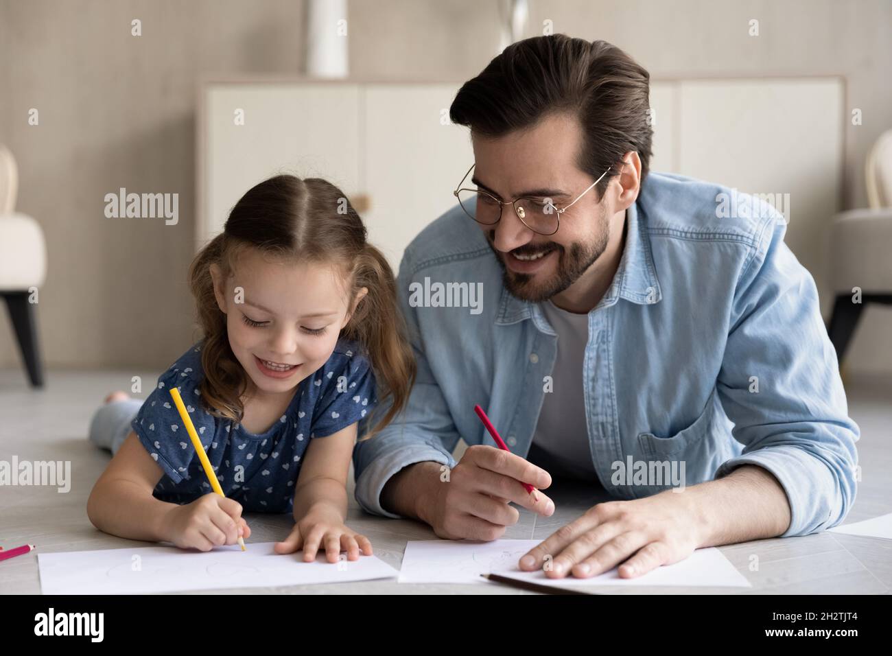 Joyful two different generations family drawing pictures Stock Photo ...