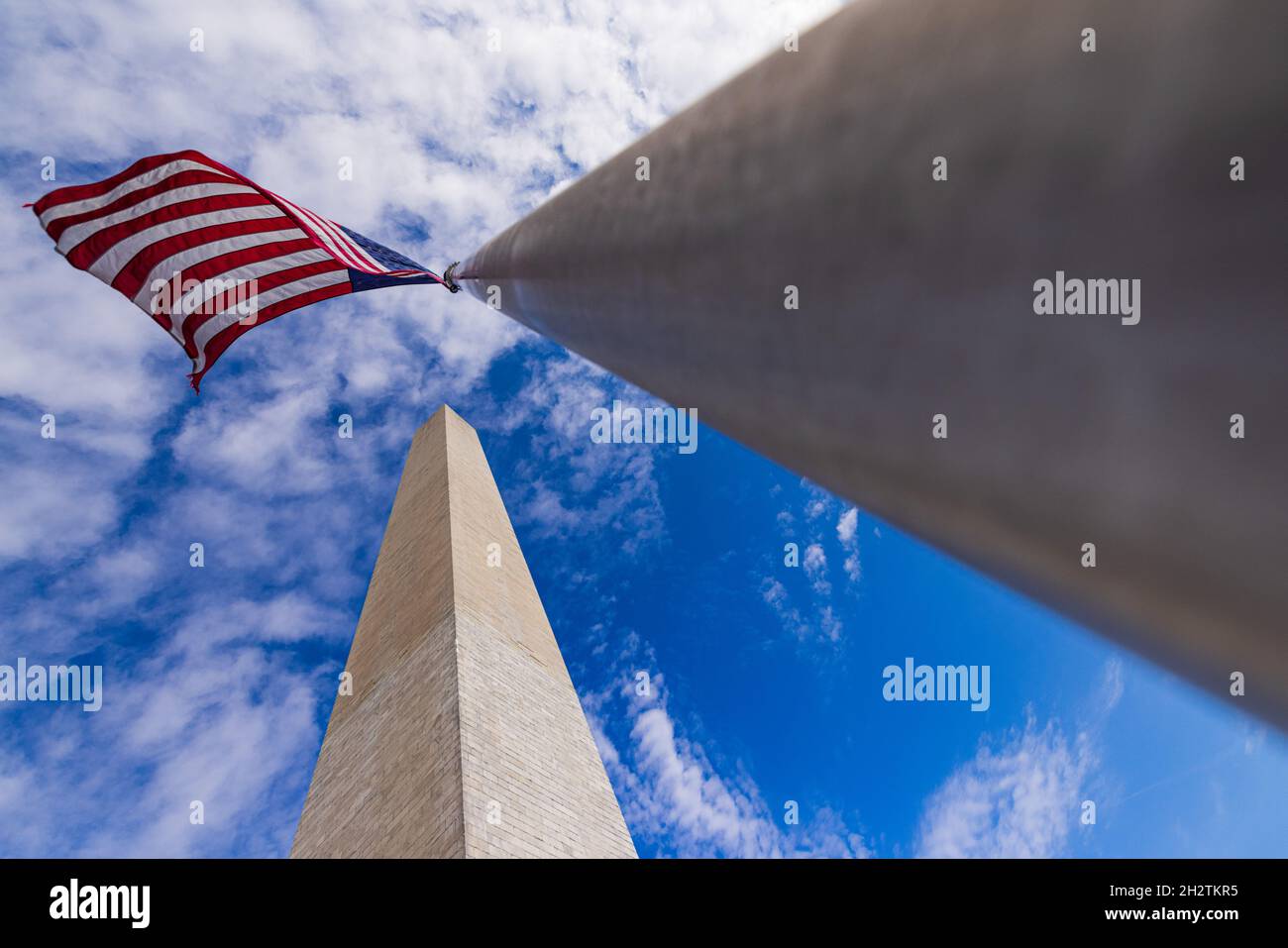 The giant Washington Monument with flags, Washington DC Stock Photo - Alamy