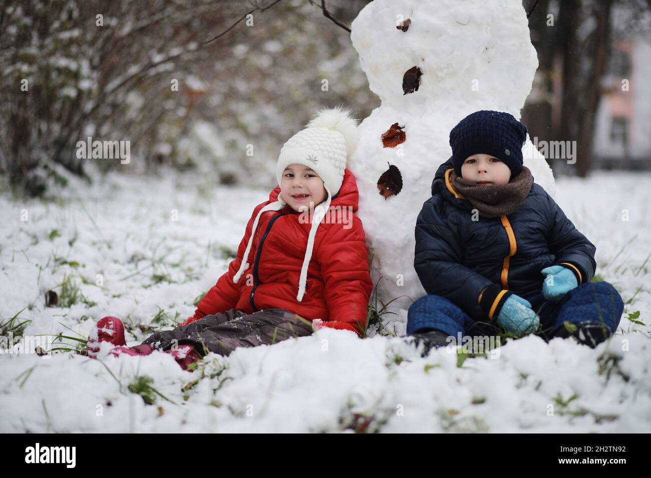 children in winter park play with snow Stock Photo - Alamy