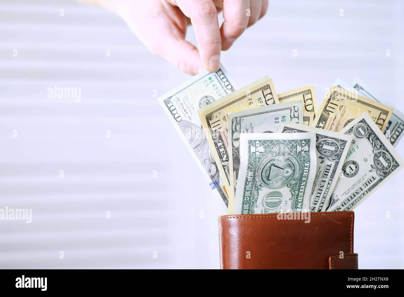 Cash money in a large pile as a finance background. Paper money close ...