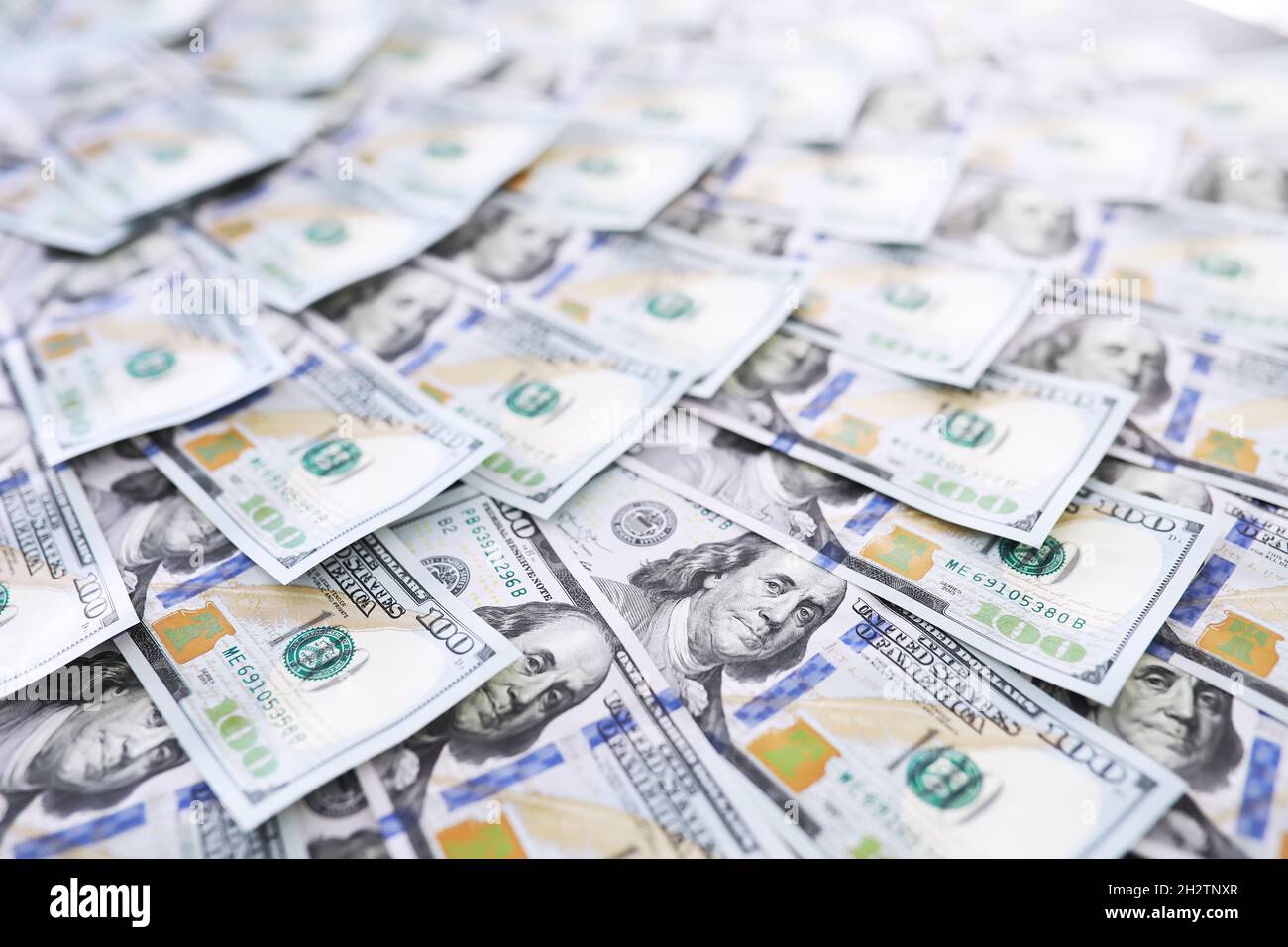 Cash money in a large pile as a finance background. Paper money close ...