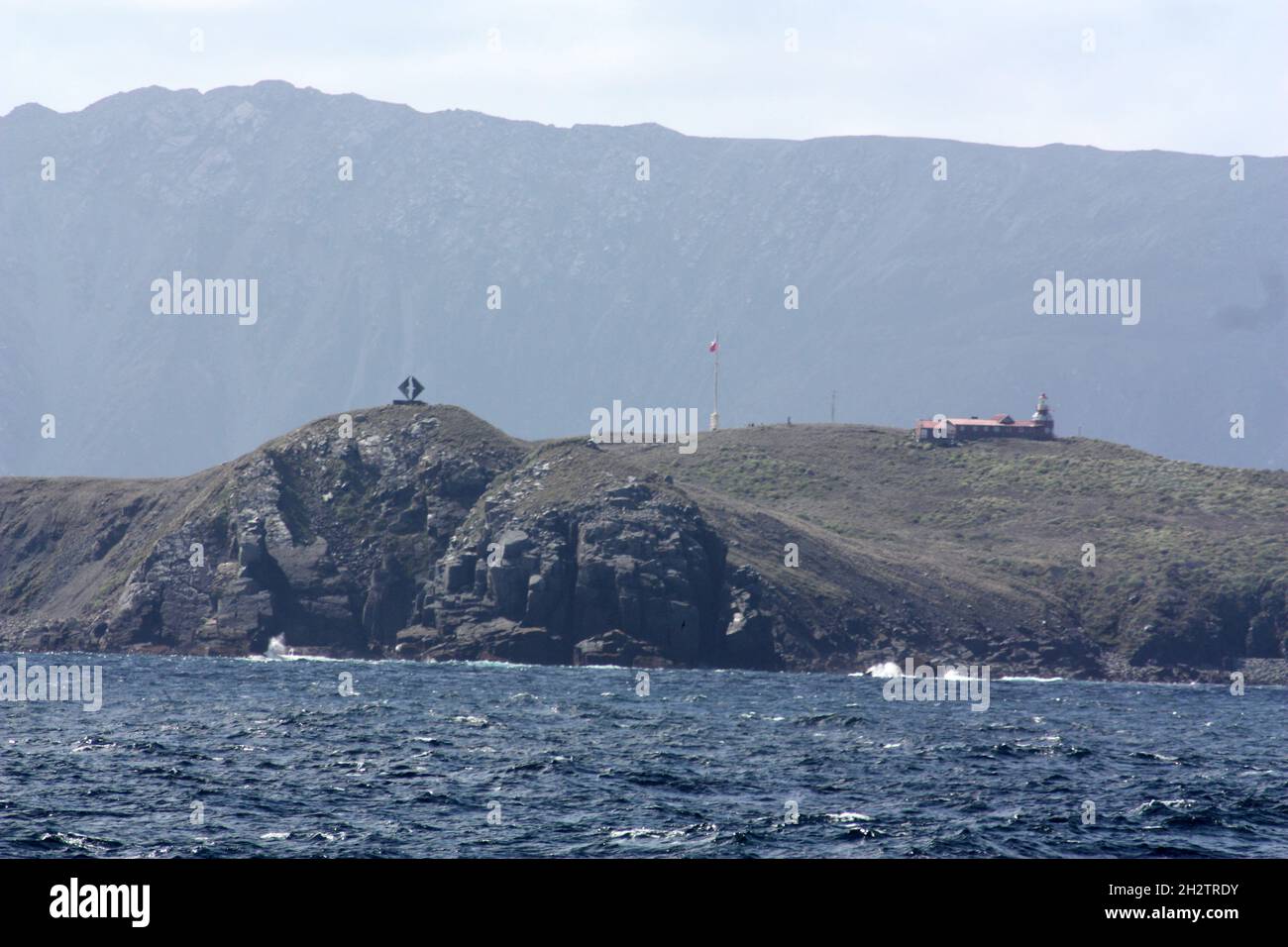 View of the monument and the Cape Horn lighthouse from Cape Horn, Chile ...