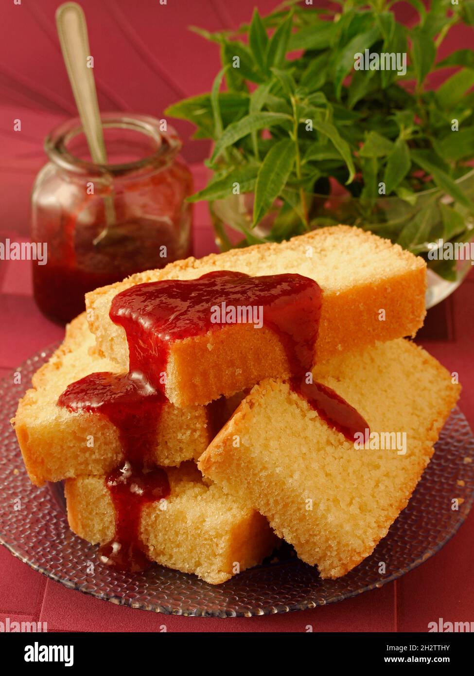 Sponge cake with strawberry jam Stock Photo - Alamy