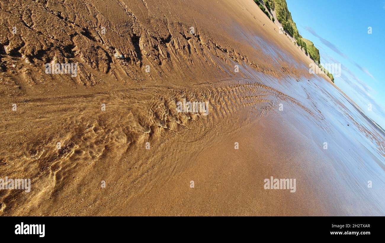 Water and patterns in sand Stock Photo - Alamy