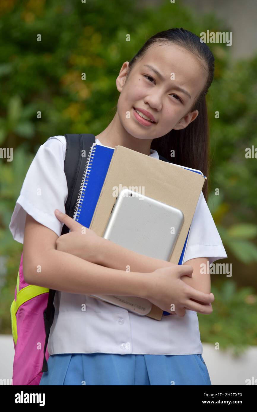 Portrait Of A Girl Student Wearing Backpack With Textbooks Stock Photo ...