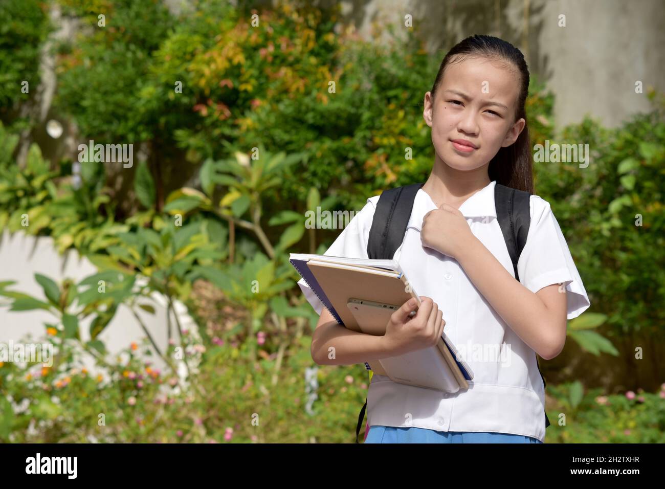 Female Student And Hope With School Books Stock Photo - Alamy
