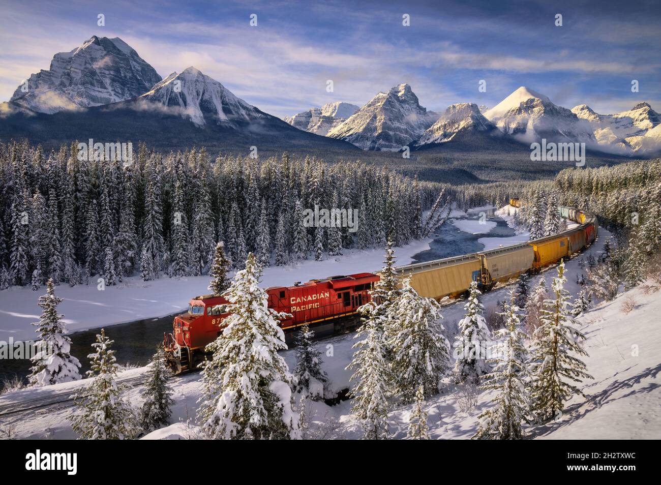 Train of Canadian Pacific Railway passing through Bow River at Morants Curve, Banff National ...