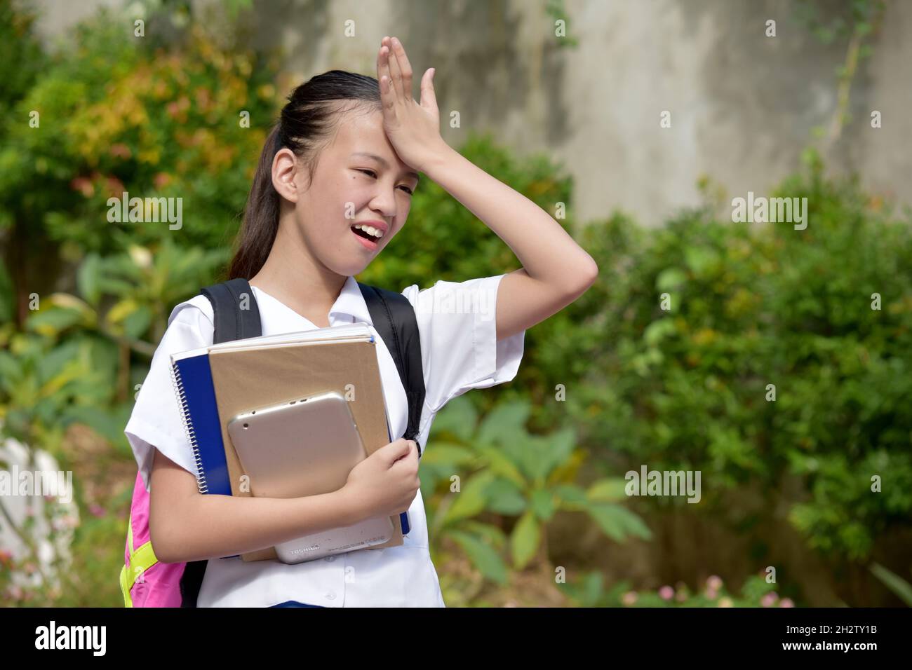 Filipina Female Student Memory Problems With Books Stock Photo - Alamy