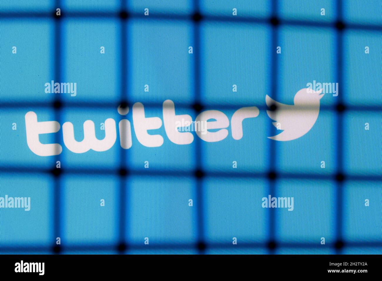 The logo of the social network Twitter behind bars. The concept of ...