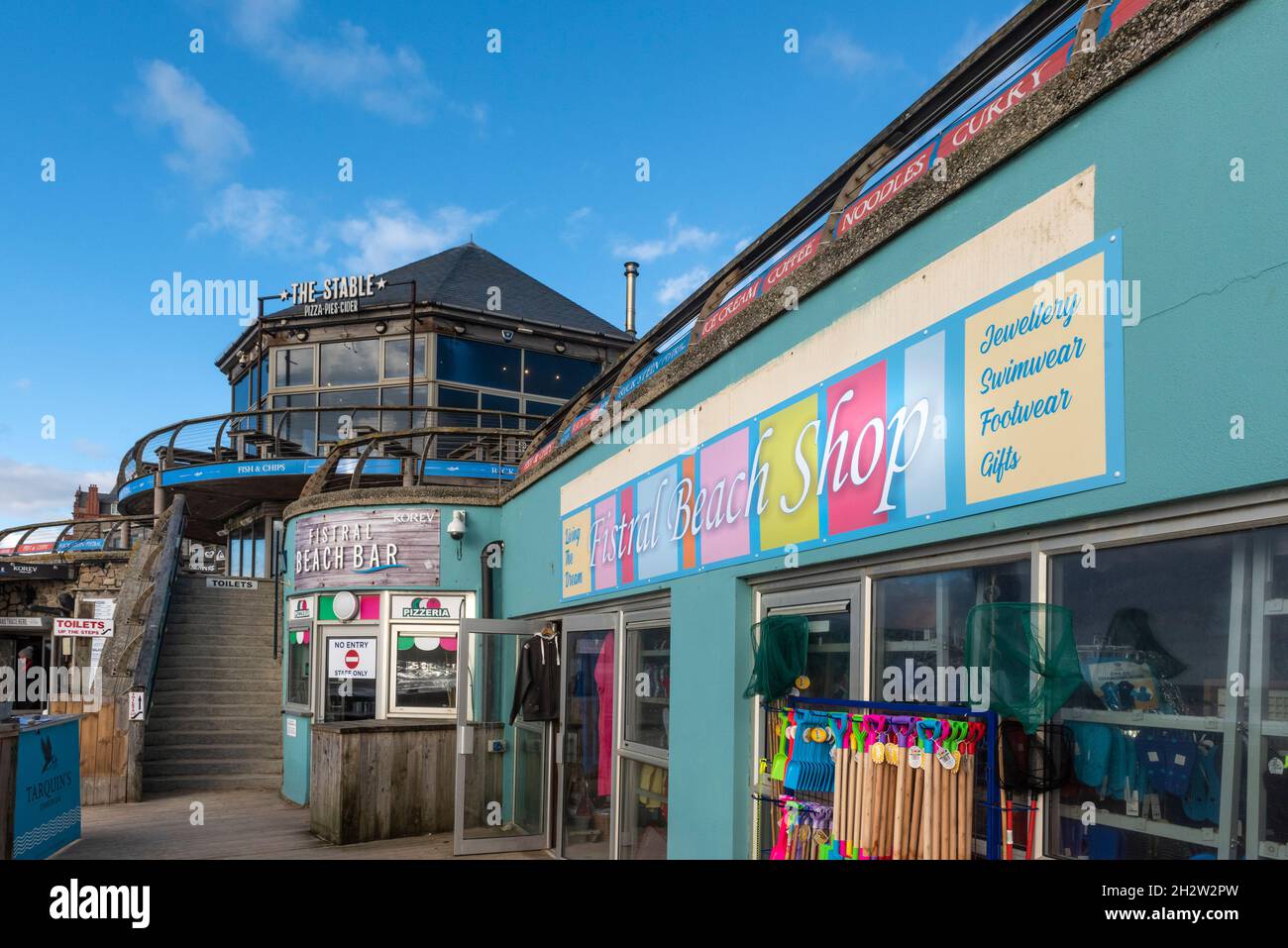 The colourful facade of the Fistral Beach Shop in Newquay in Cornwall ...