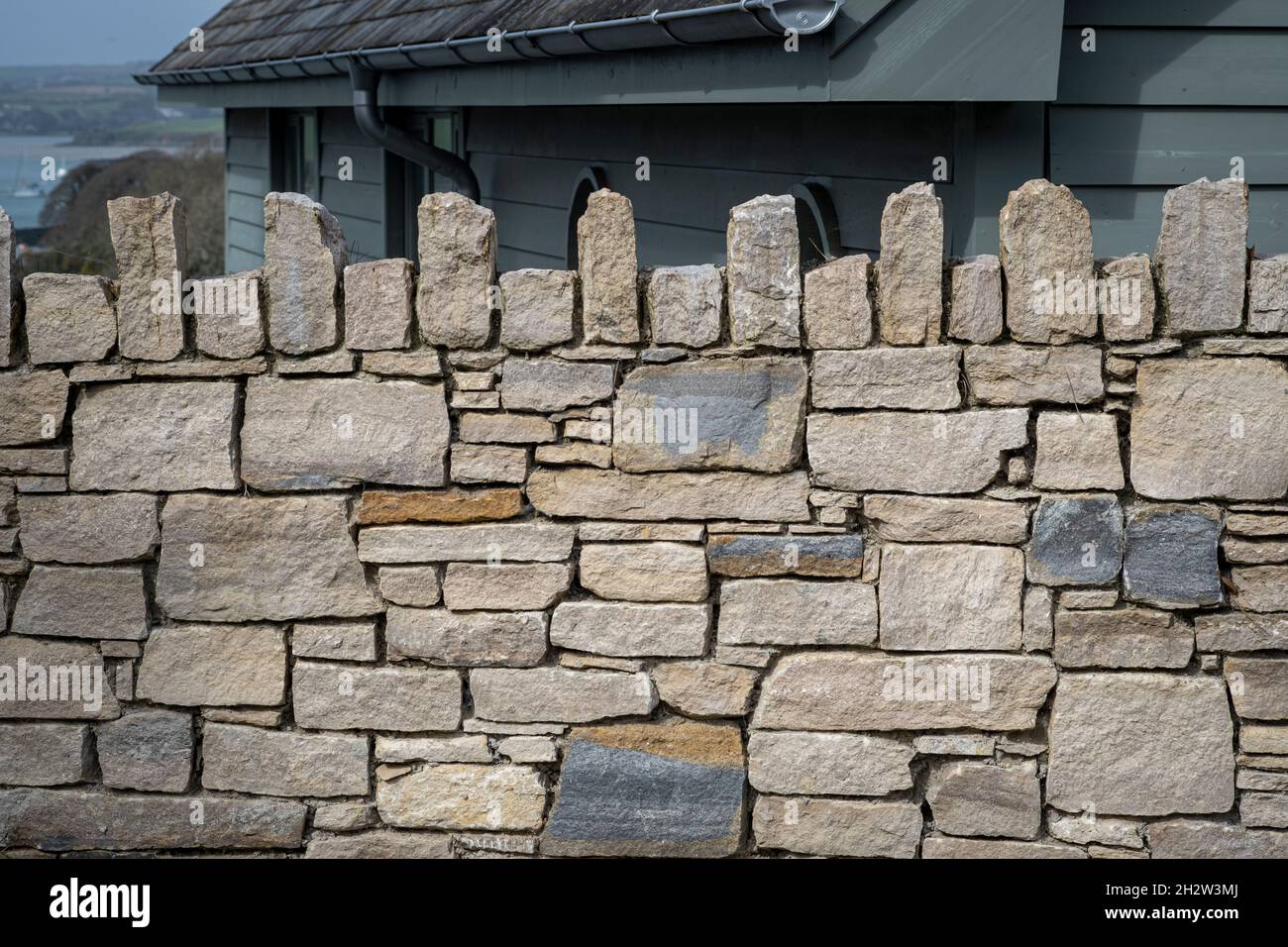 Neatly built stone wall Stock Photo - Alamy