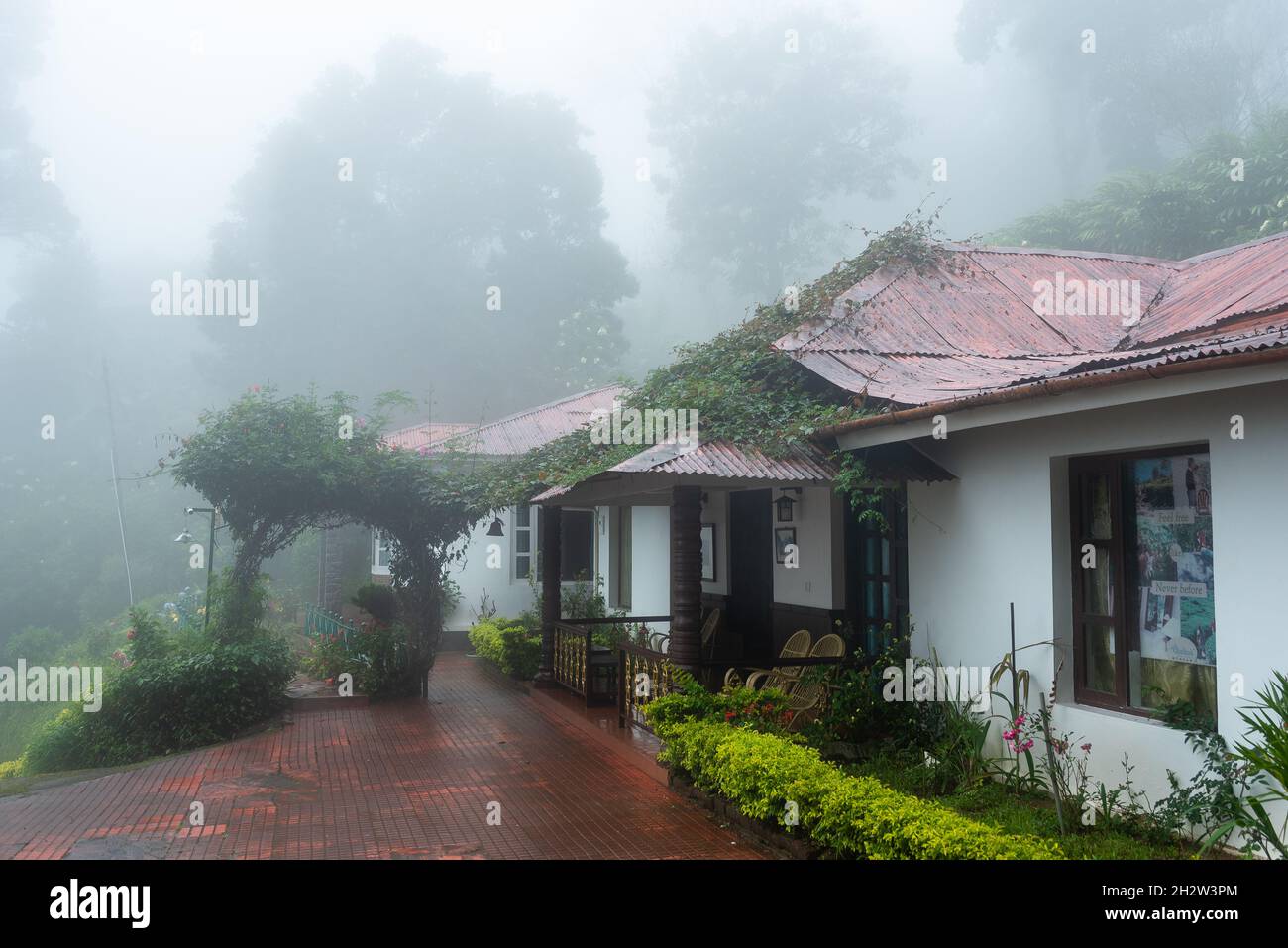 A mist clad homestay at Munnar, Kerala, India Stock Photo - Alamy