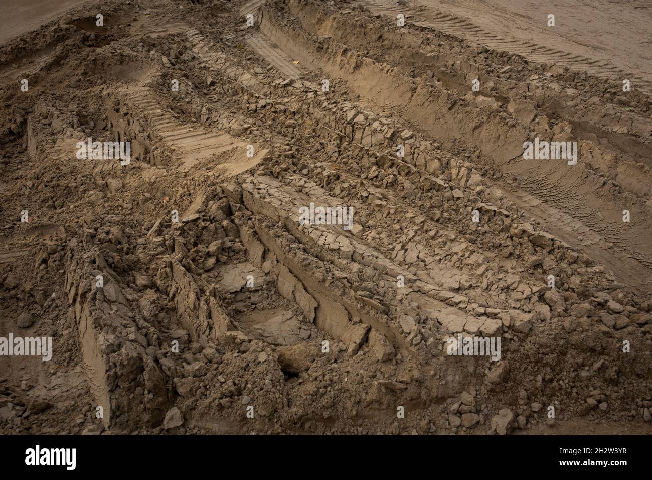 Wheel trail on sandy ground from large transport, tractor, sandy road ...