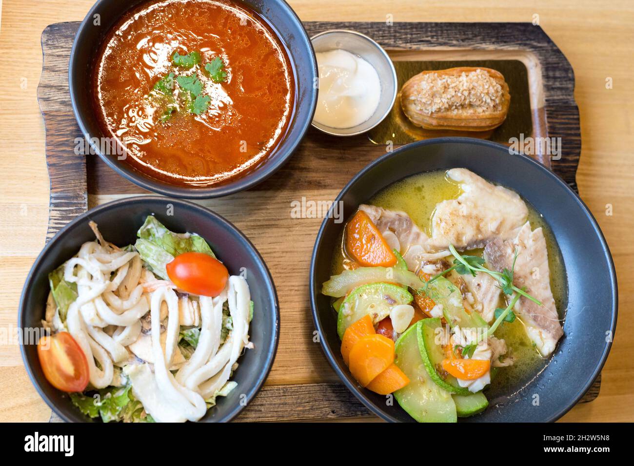 Order of three hot dishes at shopping center restaurant Stock Photo - Alamy