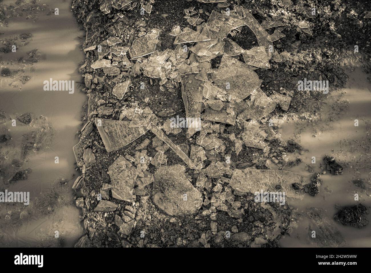 Icy country lane, muddy tyre prints Stock Photo - Alamy