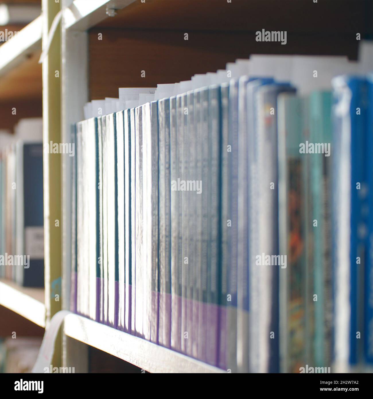 Books on a shelf in the library. Selective focus Stock Photo - Alamy