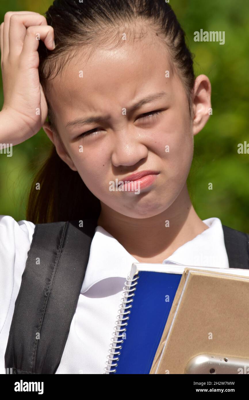 Female Student And Confusion With School Books Stock Photo - Alamy