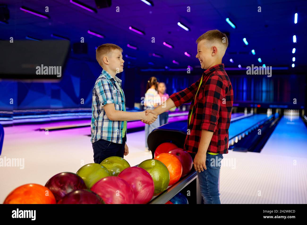 Group of children in bowling alley, little bowlers Stock Photo - Alamy