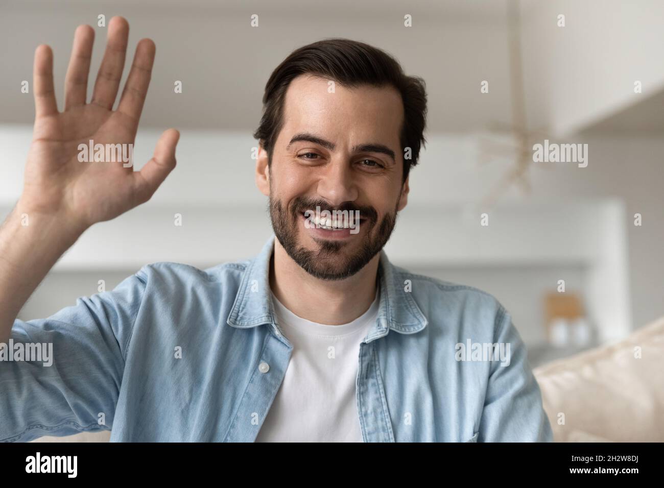 Happy millennial handsome man holding video call meeting Stock Photo ...