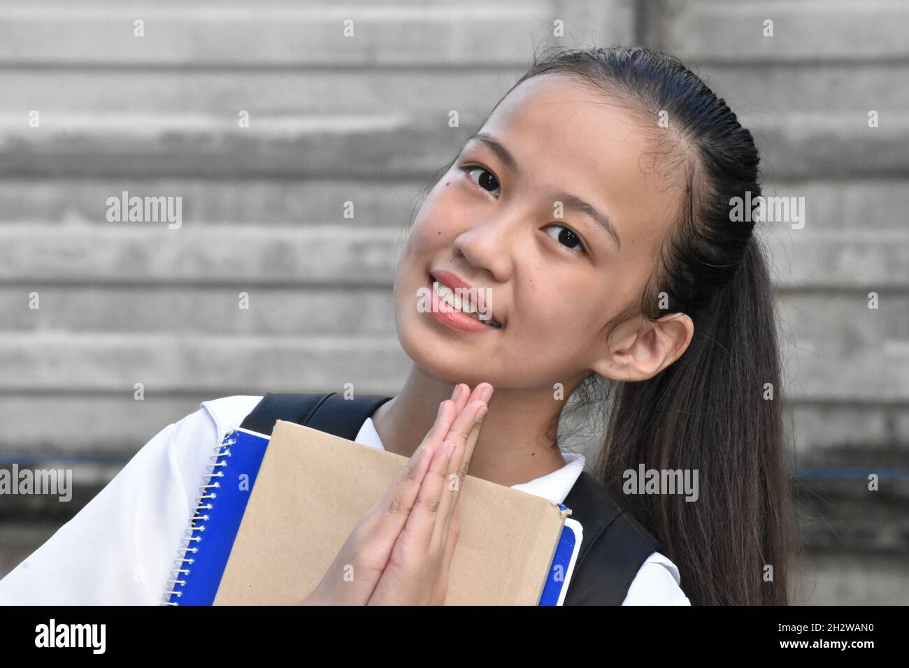 Female Student And Hope With Books Stock Photo - Alamy