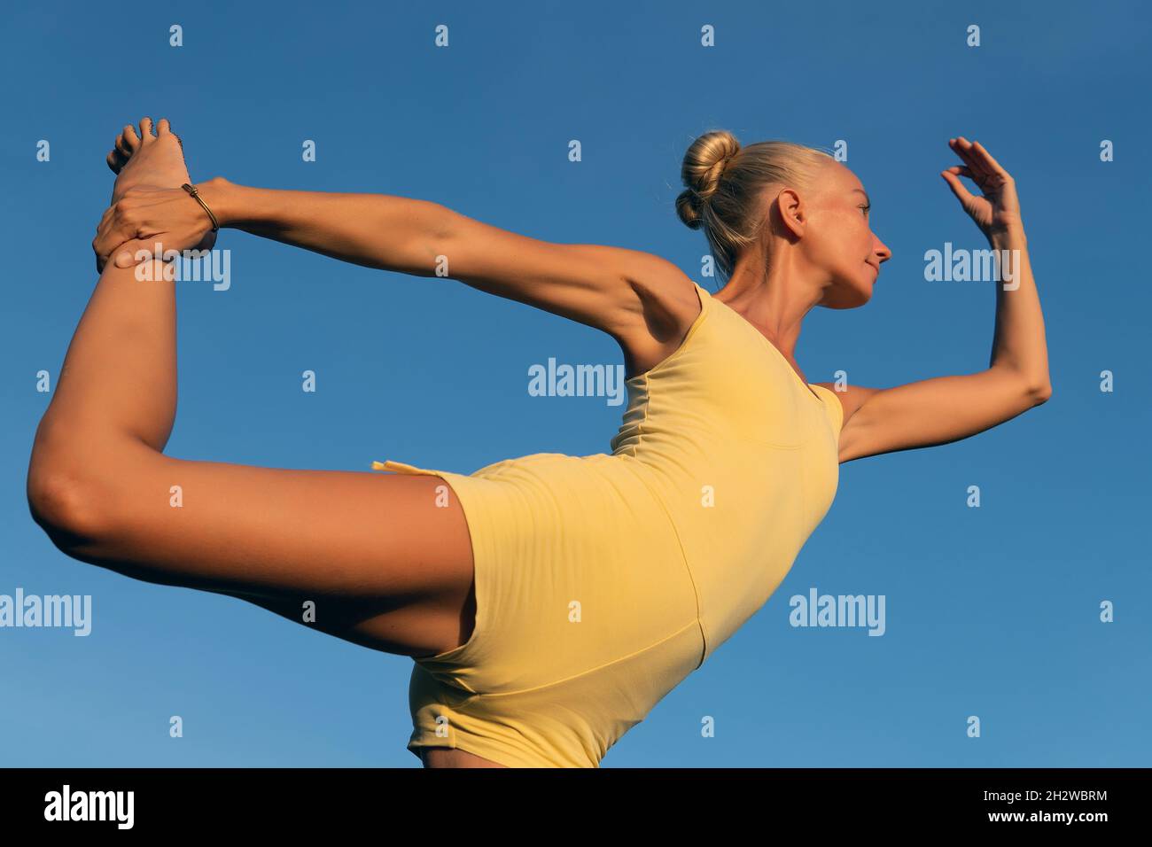 beautiful woman doing yoga on the beach. bali Stock Photo - Alamy