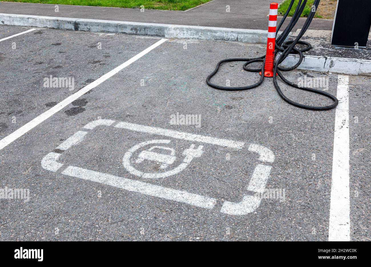 Electric vehicle charging station sign on the asphalt road Stock Photo ...
