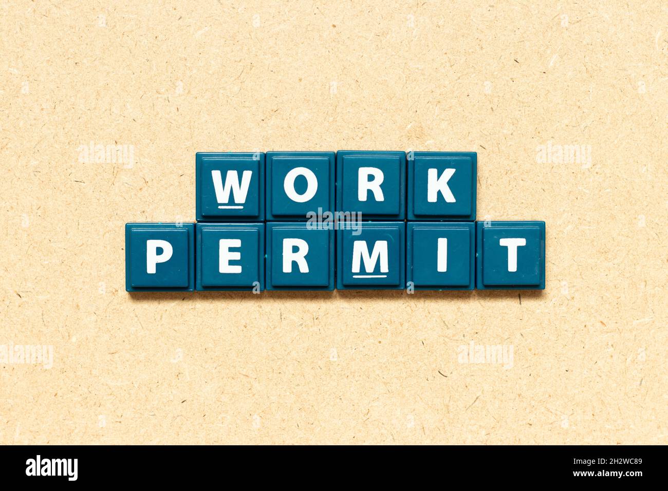 Tile alphabet letter in word work permit on wood background Stock Photo ...