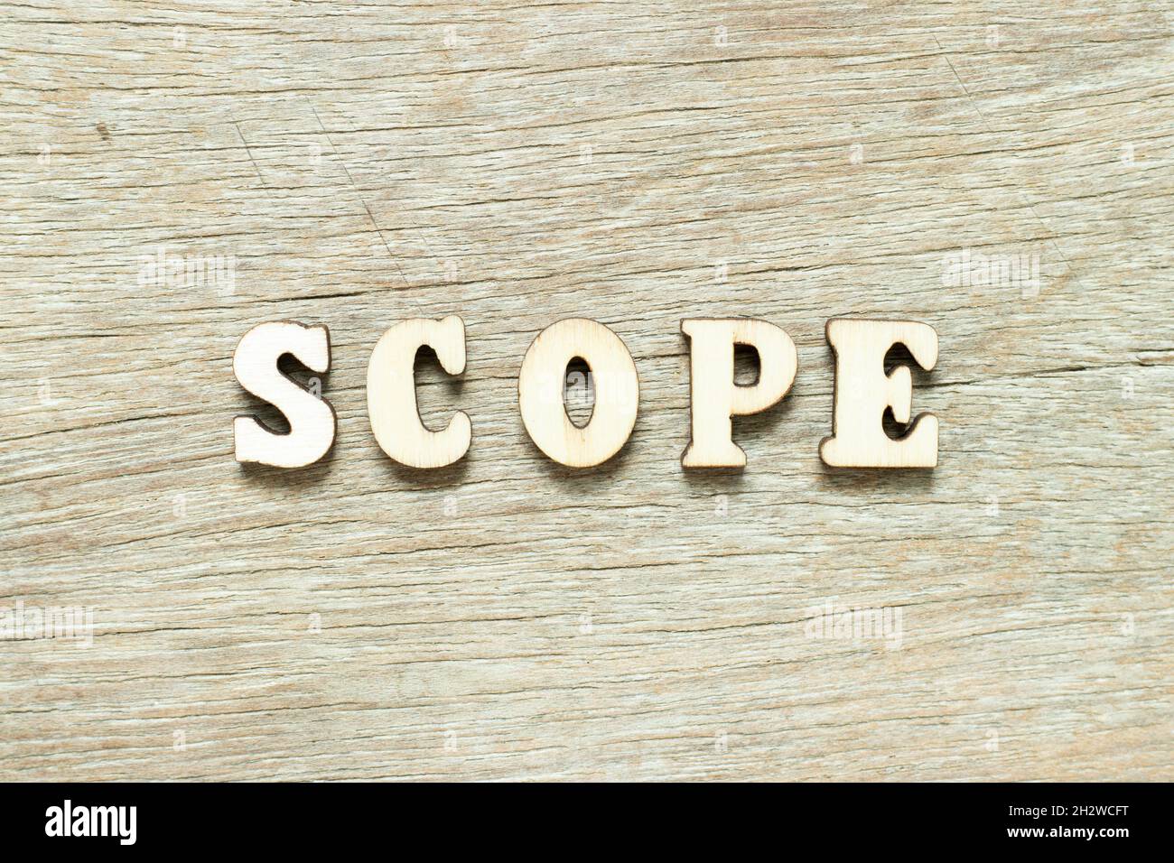 Alphabet letter in word scope on wood background Stock Photo - Alamy