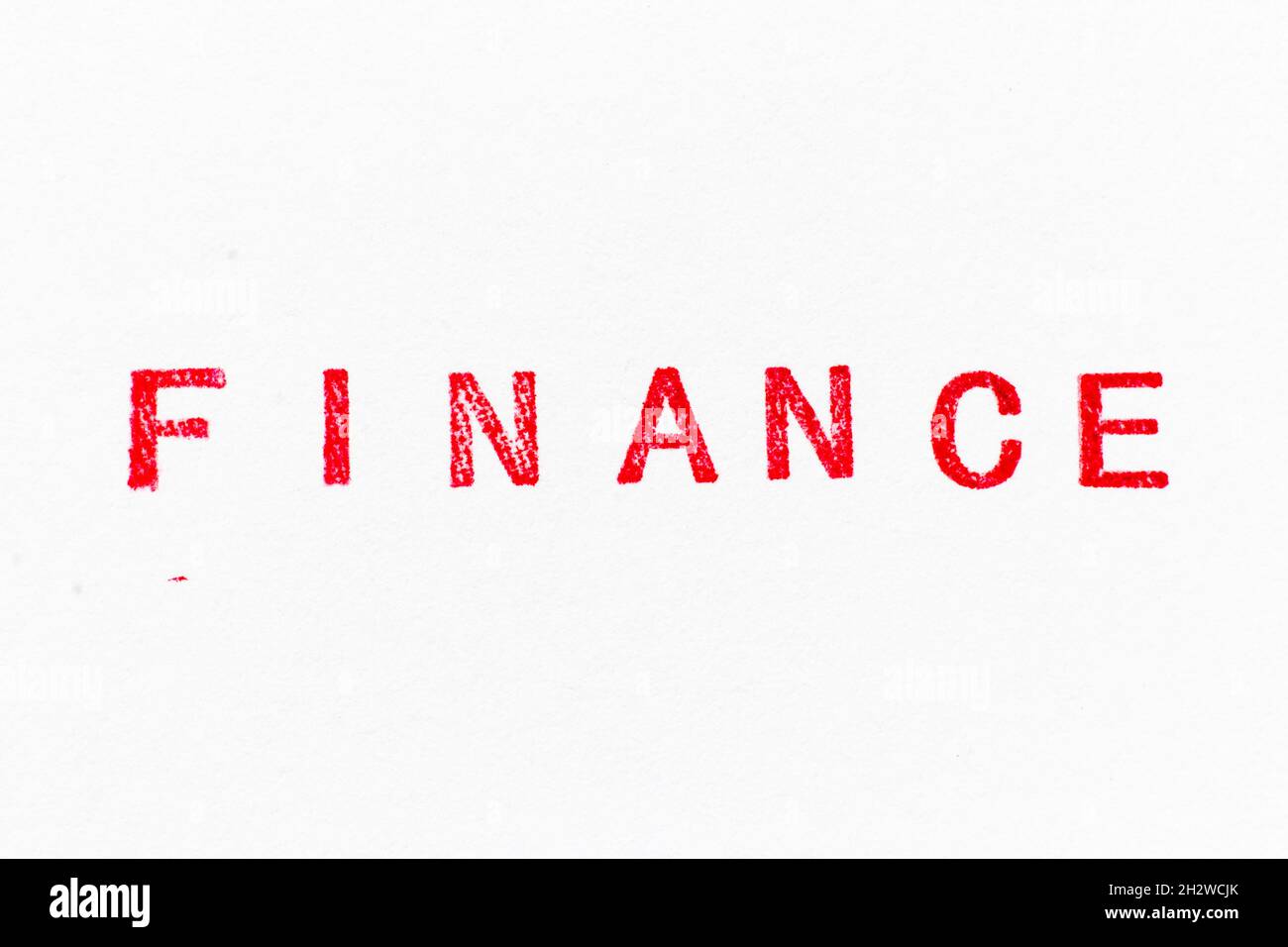 Red color ink rubber stamp in word finance on white paper background ...