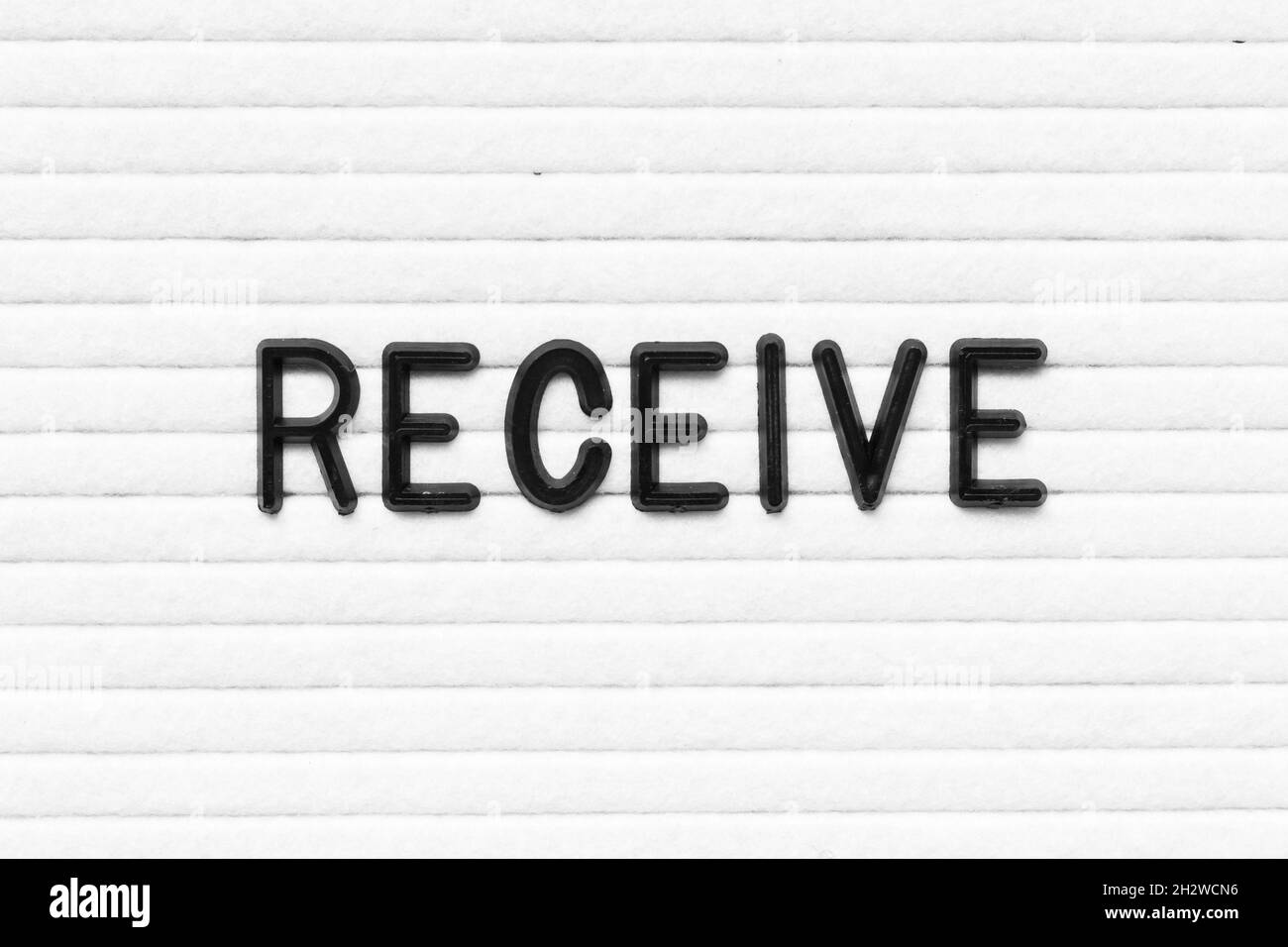 Black letter in word receive on white felt board background Stock Photo ...