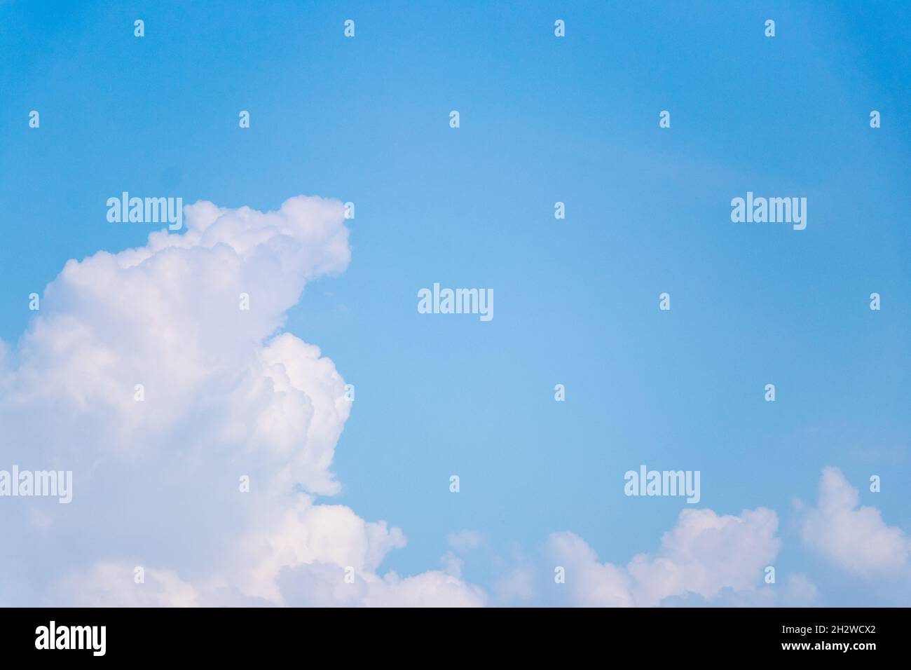 Clear blue color sky with white cloud background Stock Photo - Alamy
