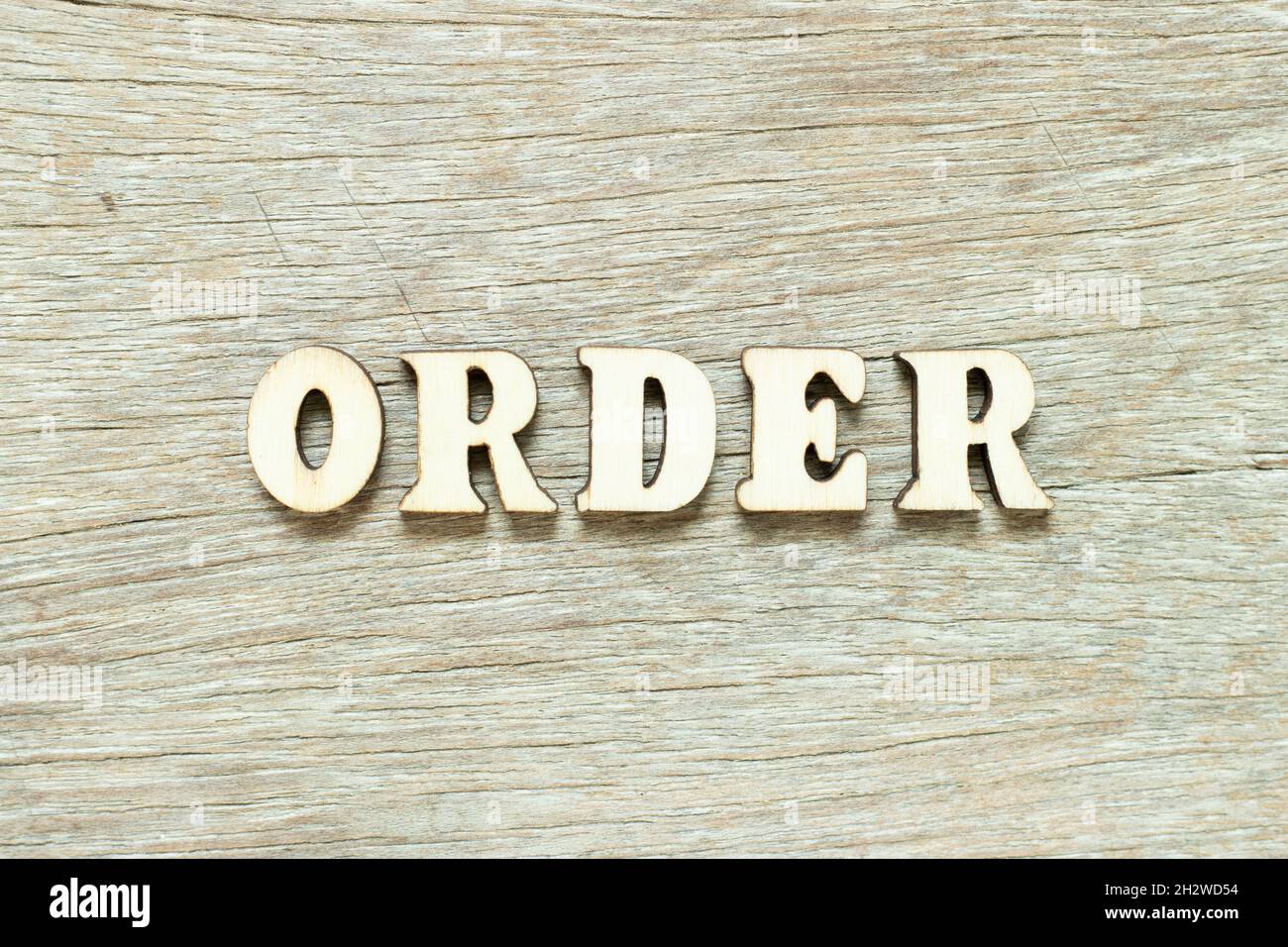 Alphabet letter in word order on wood background Stock Photo - Alamy