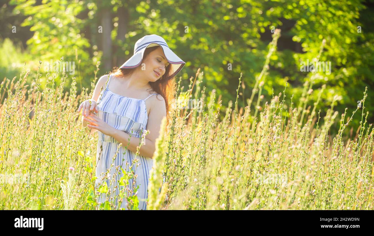 Woman running her hands through her hair hi-res stock photography and ...