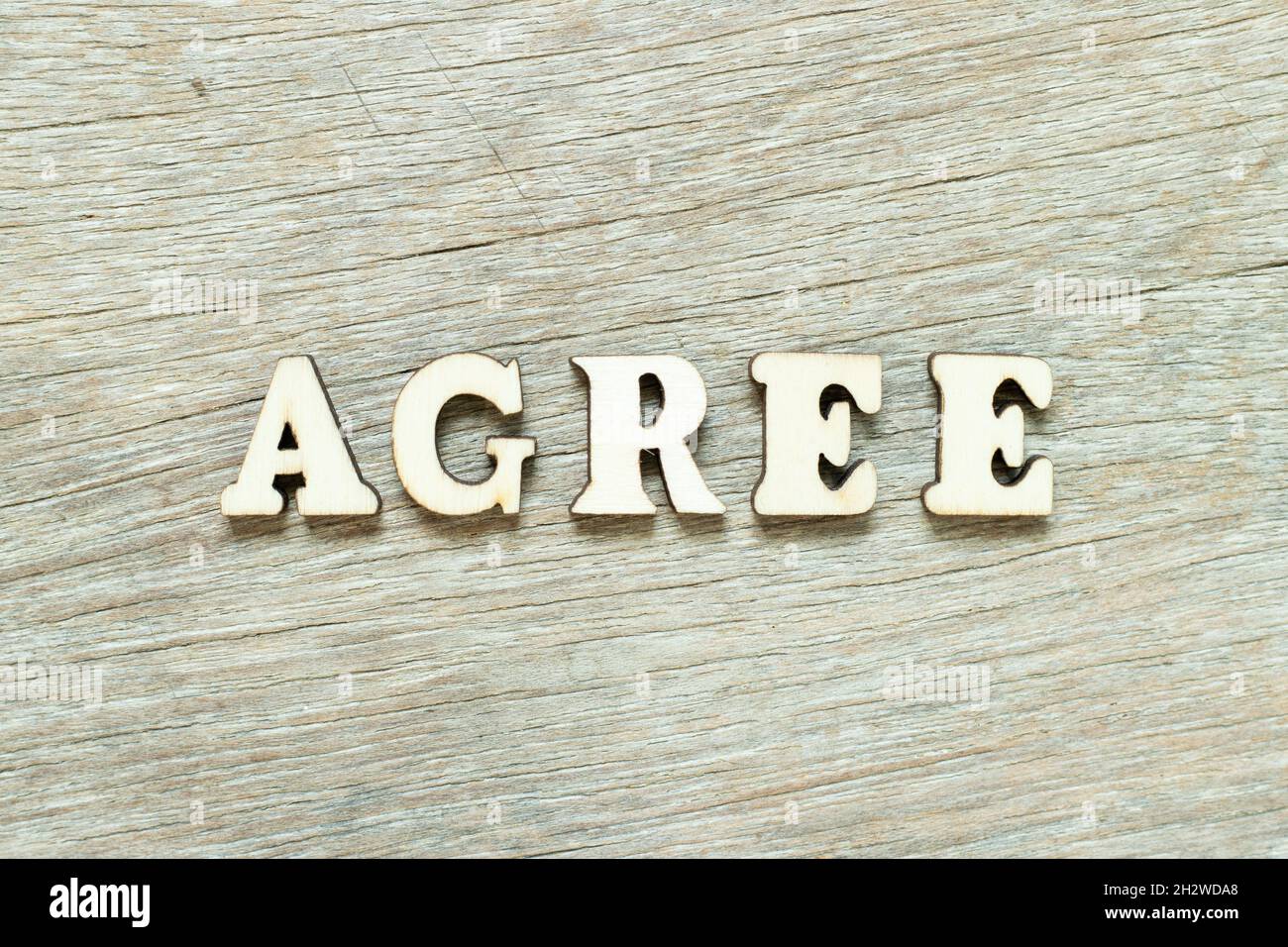 Alphabet letter in word agree on wood background Stock Photo - Alamy