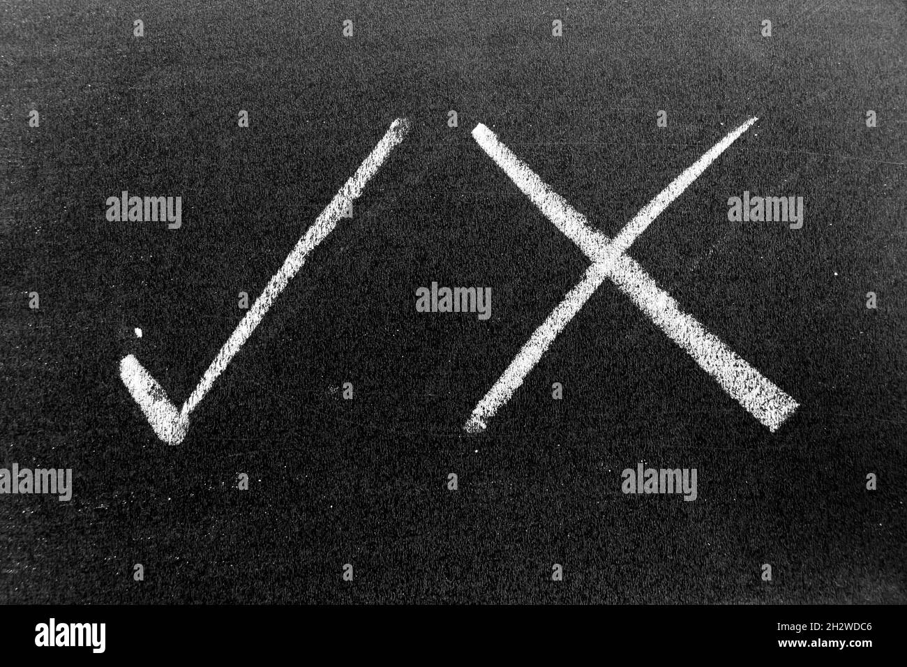 White color chalk hand drawing in check mark of right and wrong shape ...