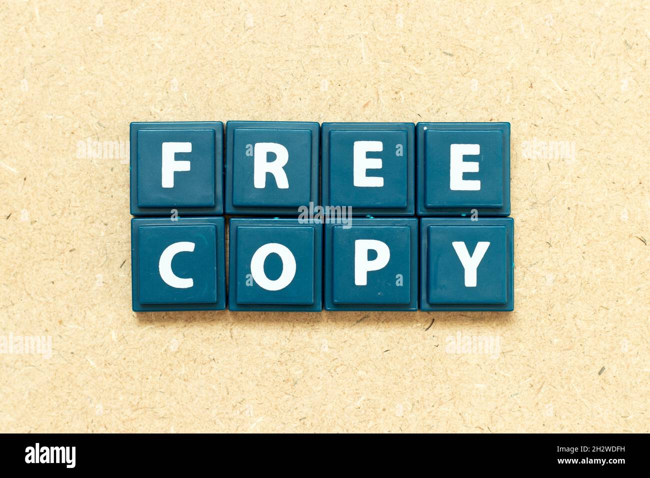 Tile alphabet letter in word free copy on wood background Stock Photo ...