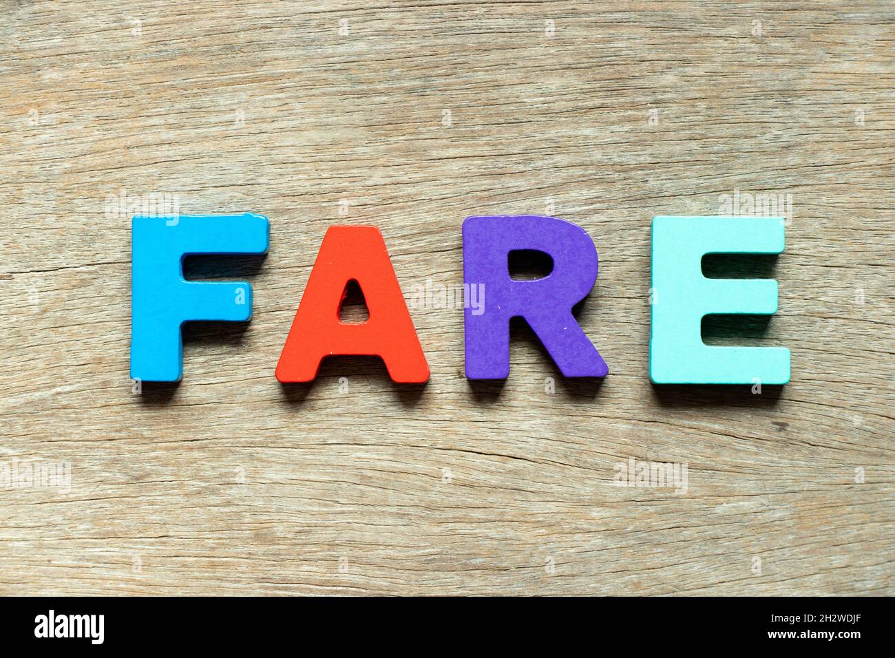 Color alphabet letter in word fare on wood background Stock Photo - Alamy
