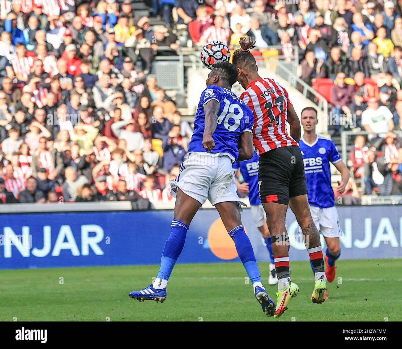 Ivan Toney #17 of Brentford heads on goal under pressure from Daniel ...