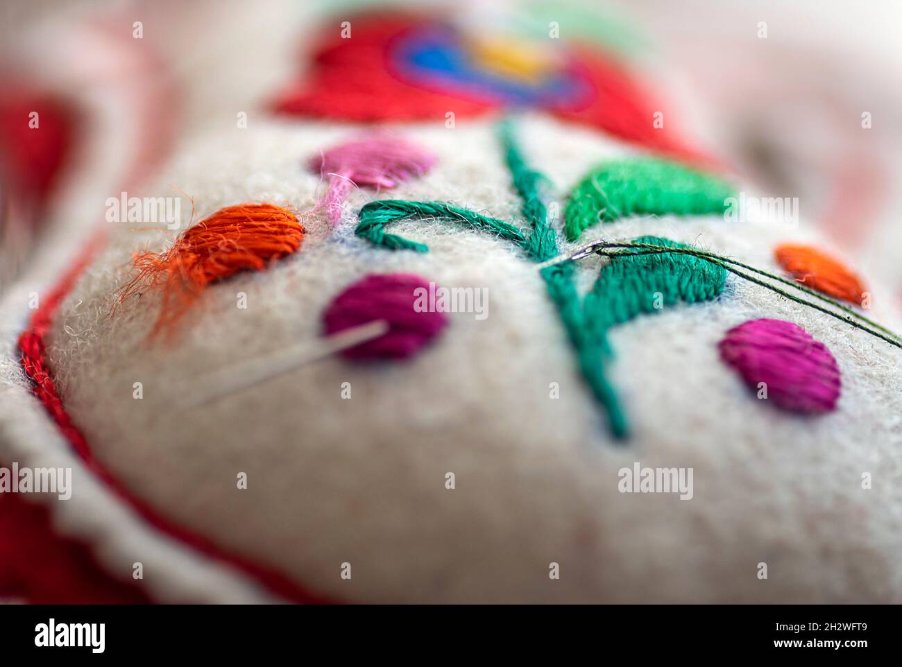 decorative needlepoint made of felt and threaded sewing needle Stock ...
