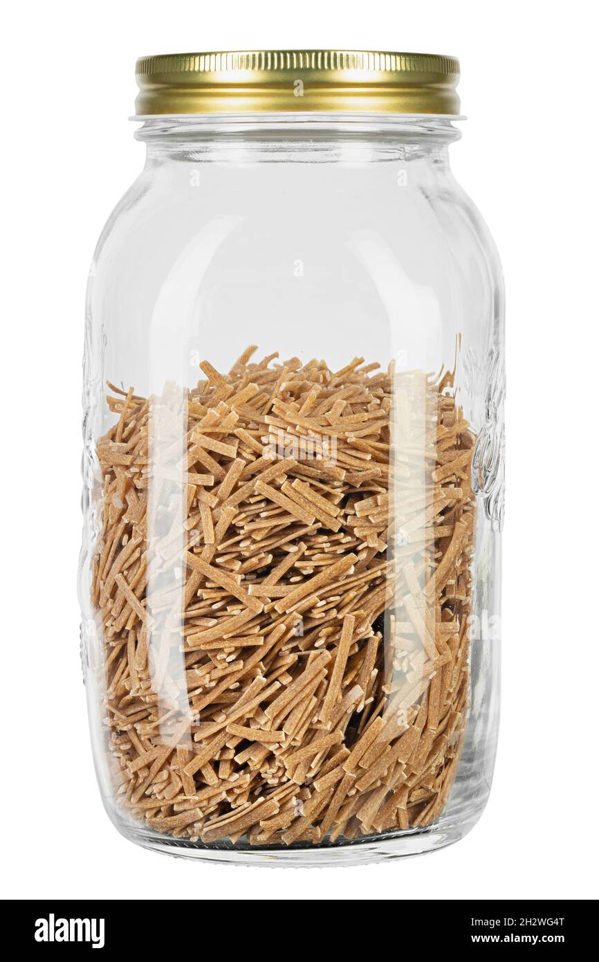 Glass jar filled raw pasta isolated on white background. File contains ...