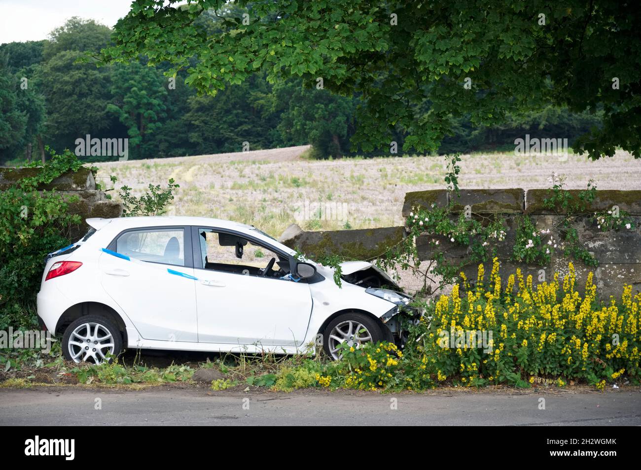 Car crash in rural countryside and damaged wall Stock Photo - Alamy